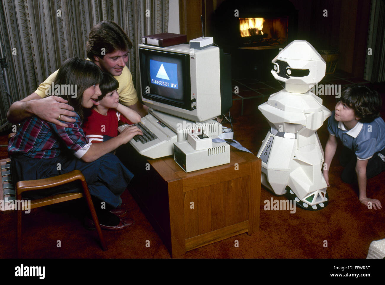 ROBOT: TOPO, c1983. /nAn American family using an Apple II computer to ...