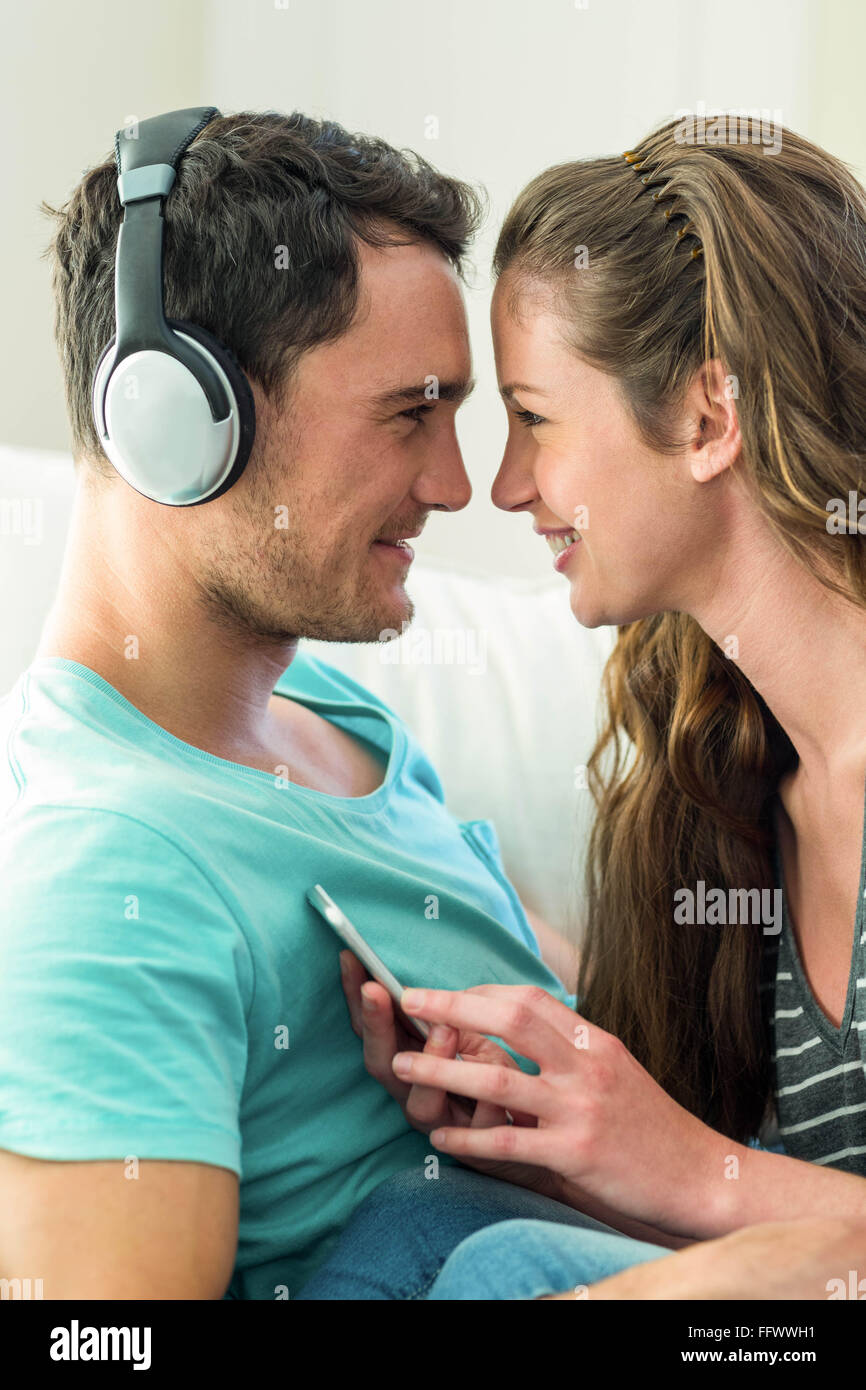 Beautiful couple listening music headphones hi-res stock photography ...
