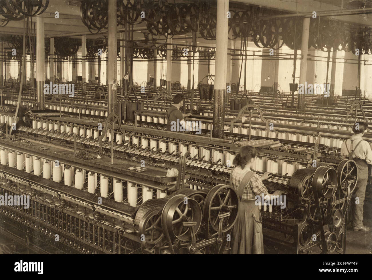 HINE: TEXTILE MILL, 1912. /nThe spinning room at the Flint Cotton Mill ...