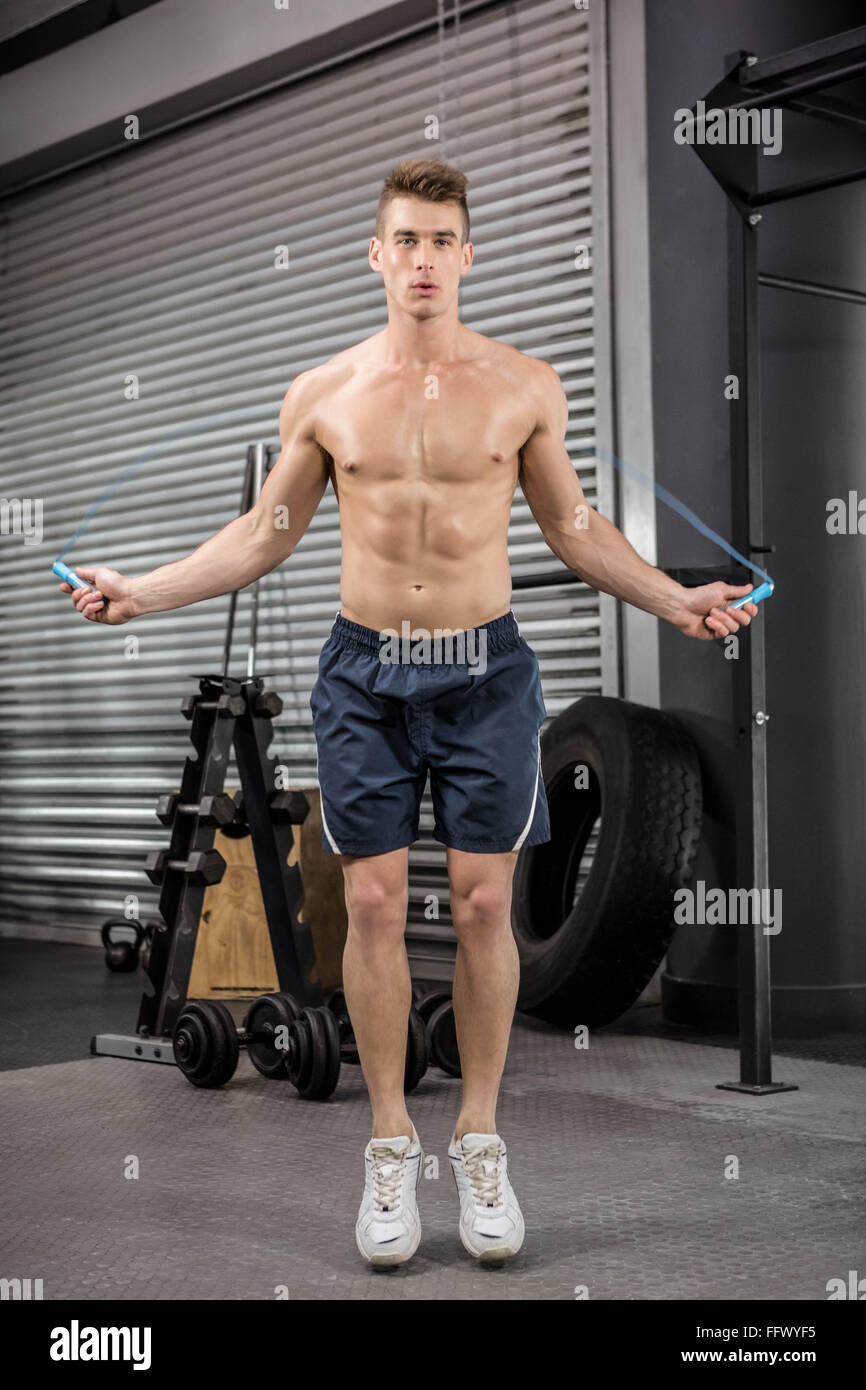 Shirtless man jumping the rope Stock Photo - Alamy