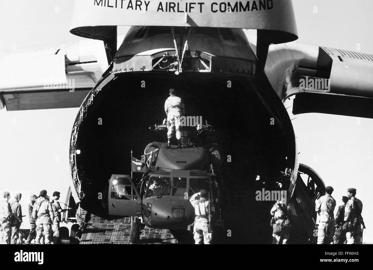 C-5 TRANSPORT AIRCRAFT. /nA helicopter being loaded aboard a Lockheed C ...