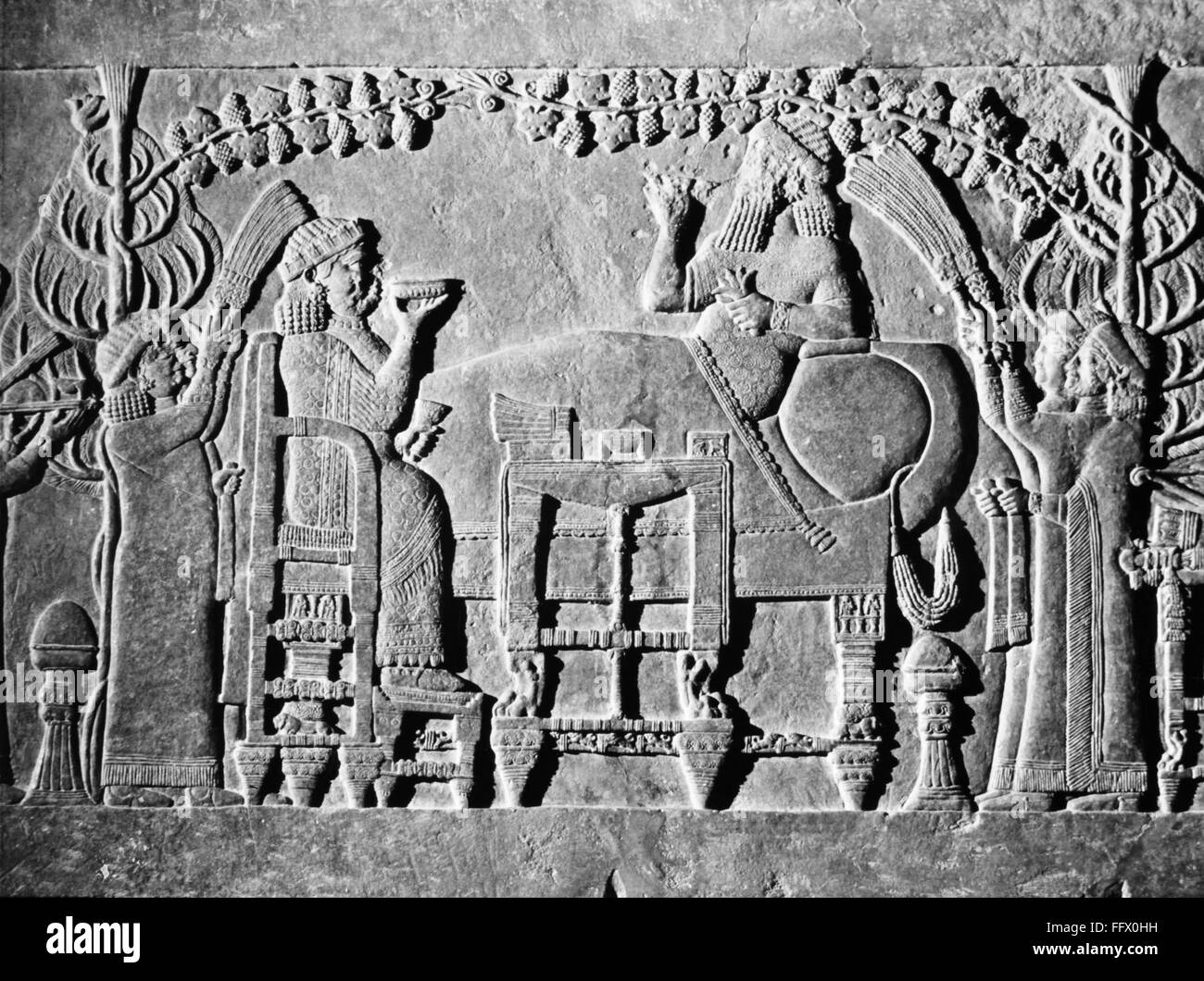 ASSYRIAN FEAST, c645 B.C. /nAshurbanipal and his queen feasting in a ...