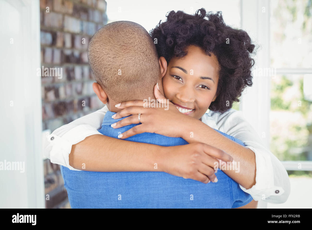 Happy couple embracing Stock Photo - Alamy
