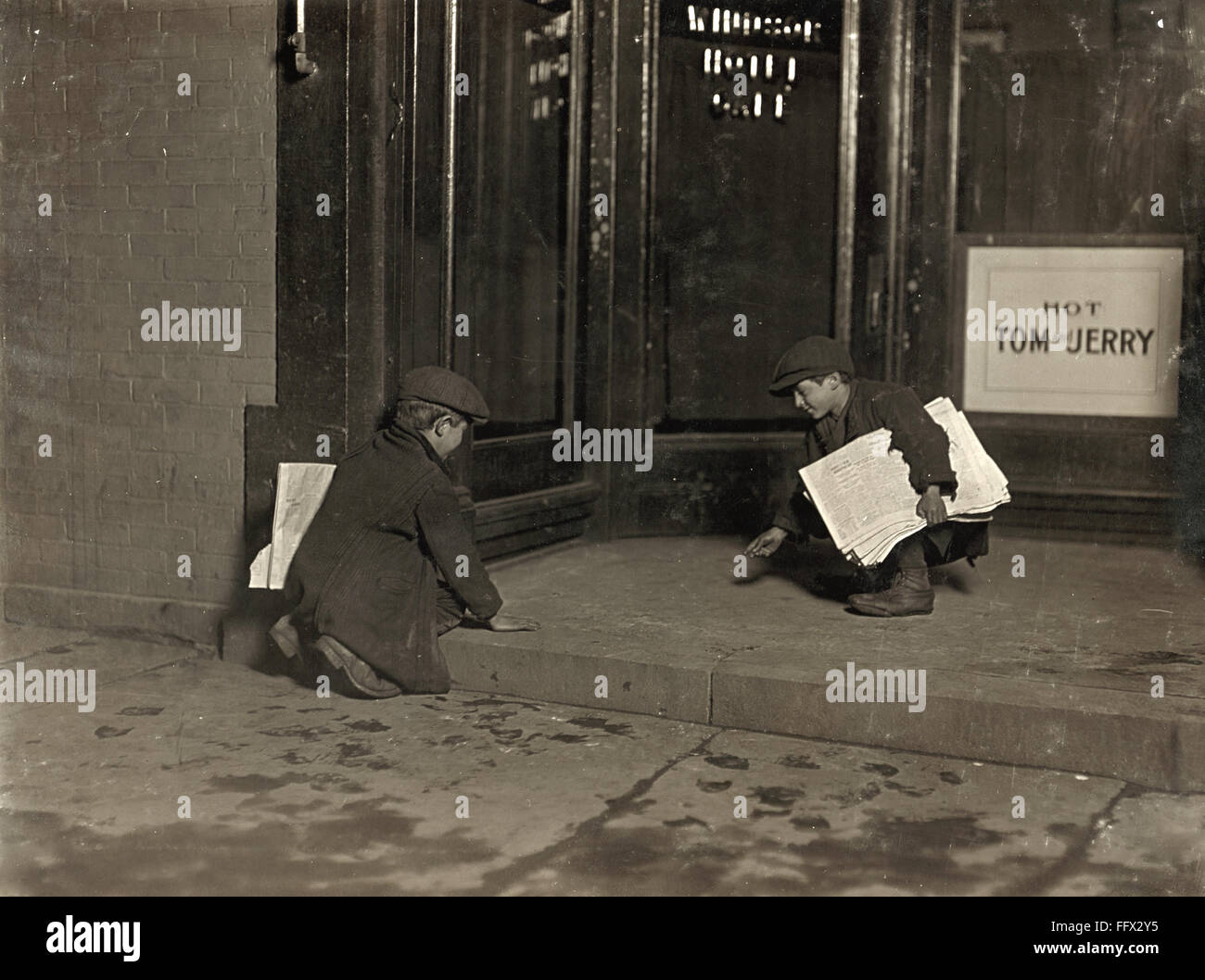 PITCHING PENNIES, 1909. /nTwo newsboys, eight and ten years-old ...