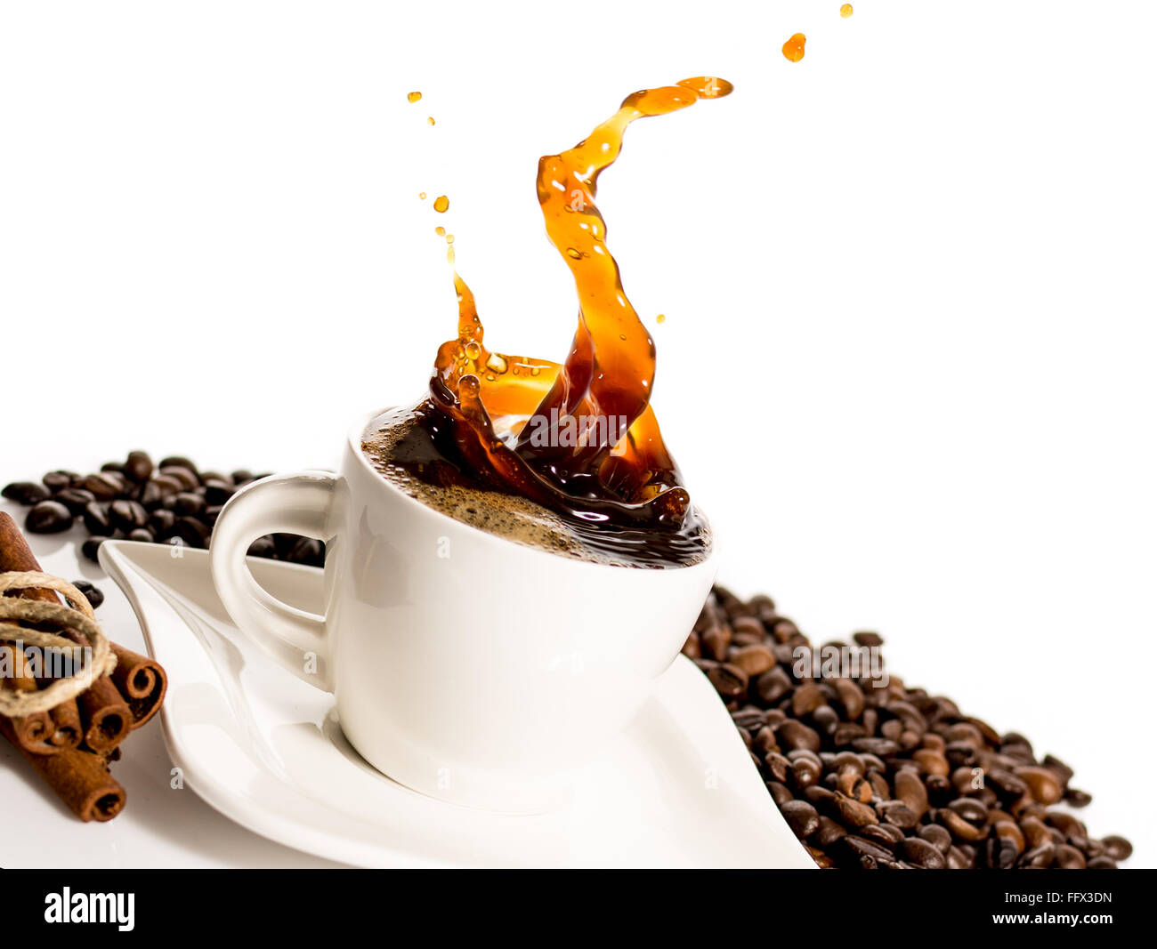 White cup of coffee splash on white background Stock Photo - Alamy