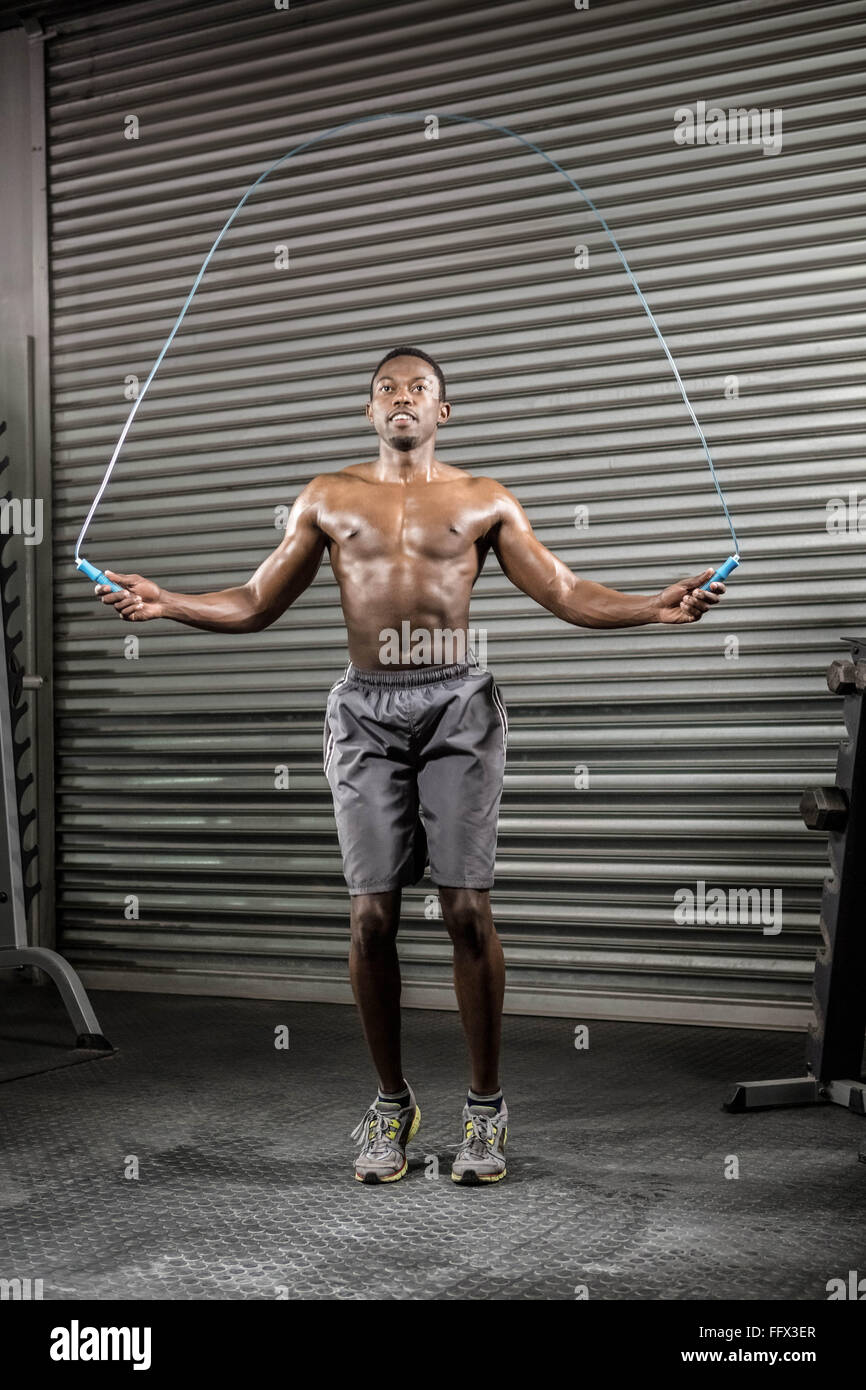 Shirtless man jumping the rope Stock Photo - Alamy
