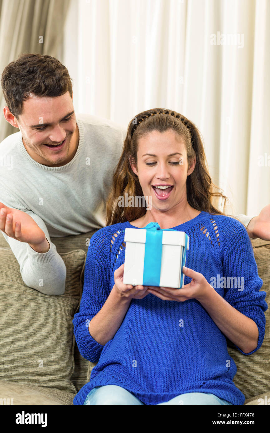 Woman receiving a surprise gift Stock Photo - Alamy