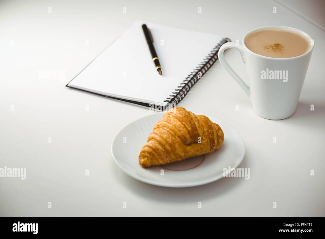 Notebook with pen and coffee by food Stock Photo - Alamy