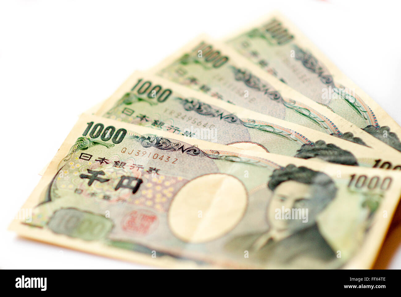1000 yen notes on a white background Stock Photo - Alamy