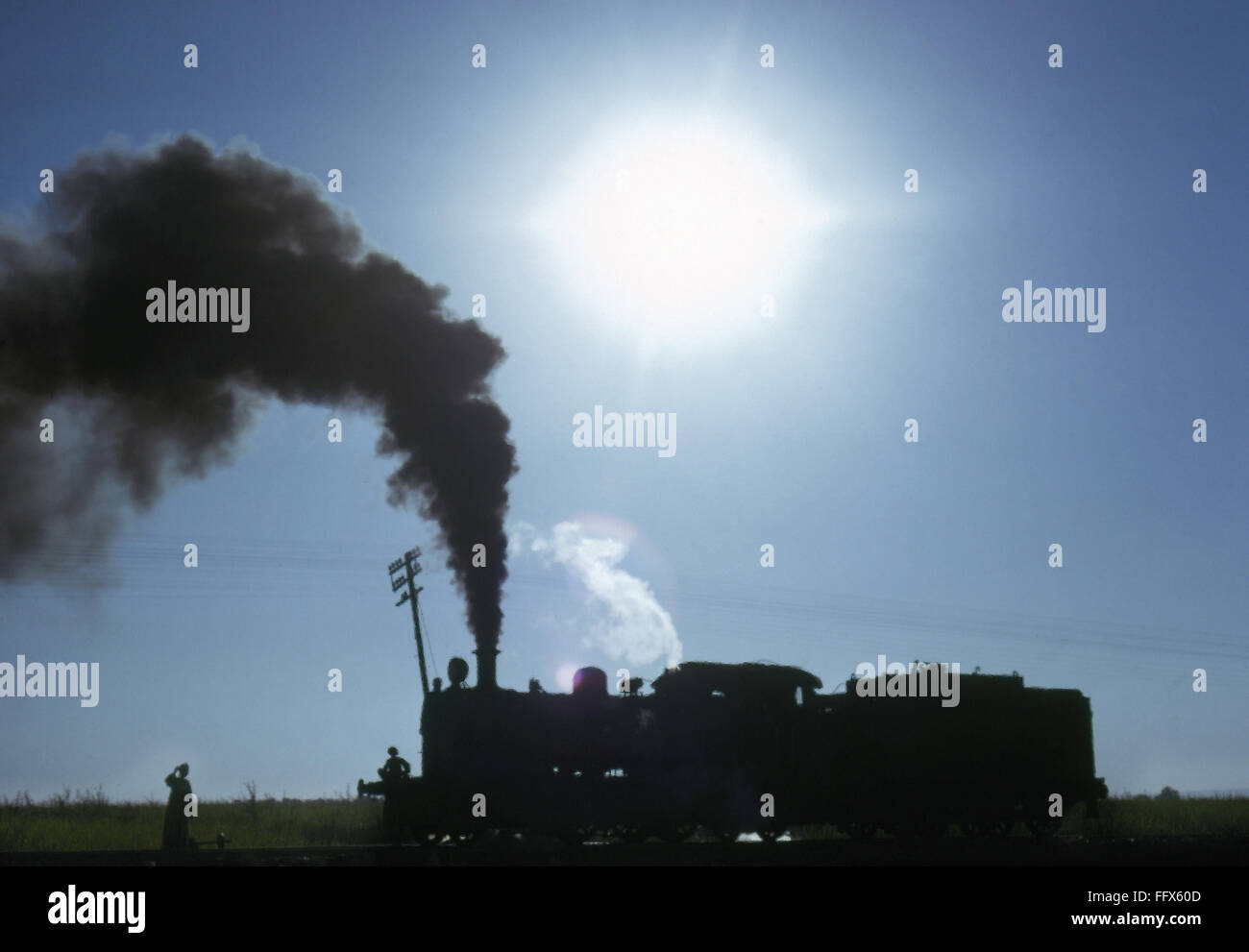 EGYPT: LOCOMOTIVE. /nA locomotive letting off steam as it waits on the ...