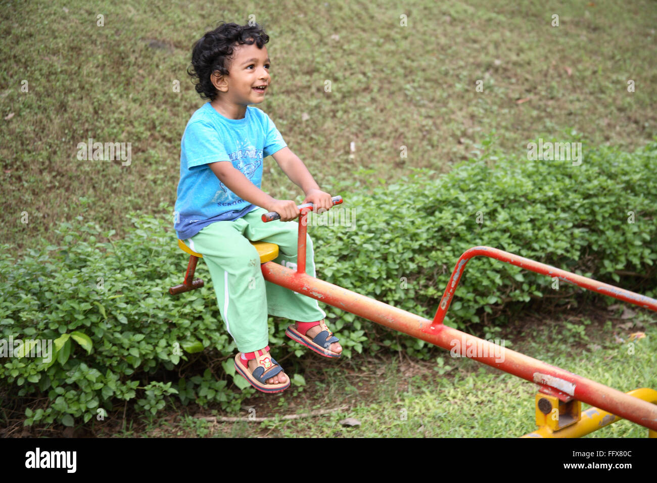 Children playing on see saw hi-res stock photography and images - Alamy
