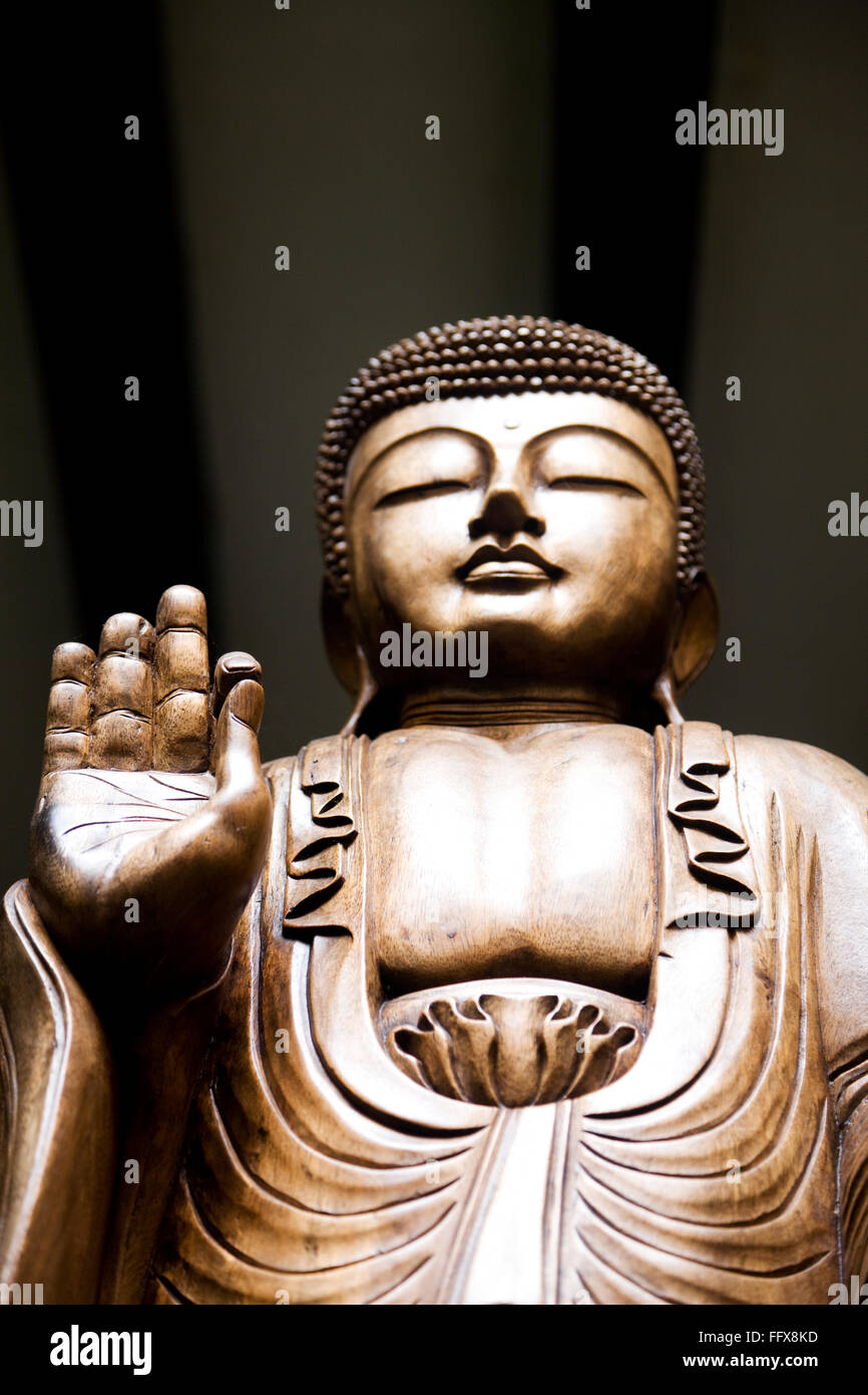 Buddha statue rising hand Stock Photo - Alamy