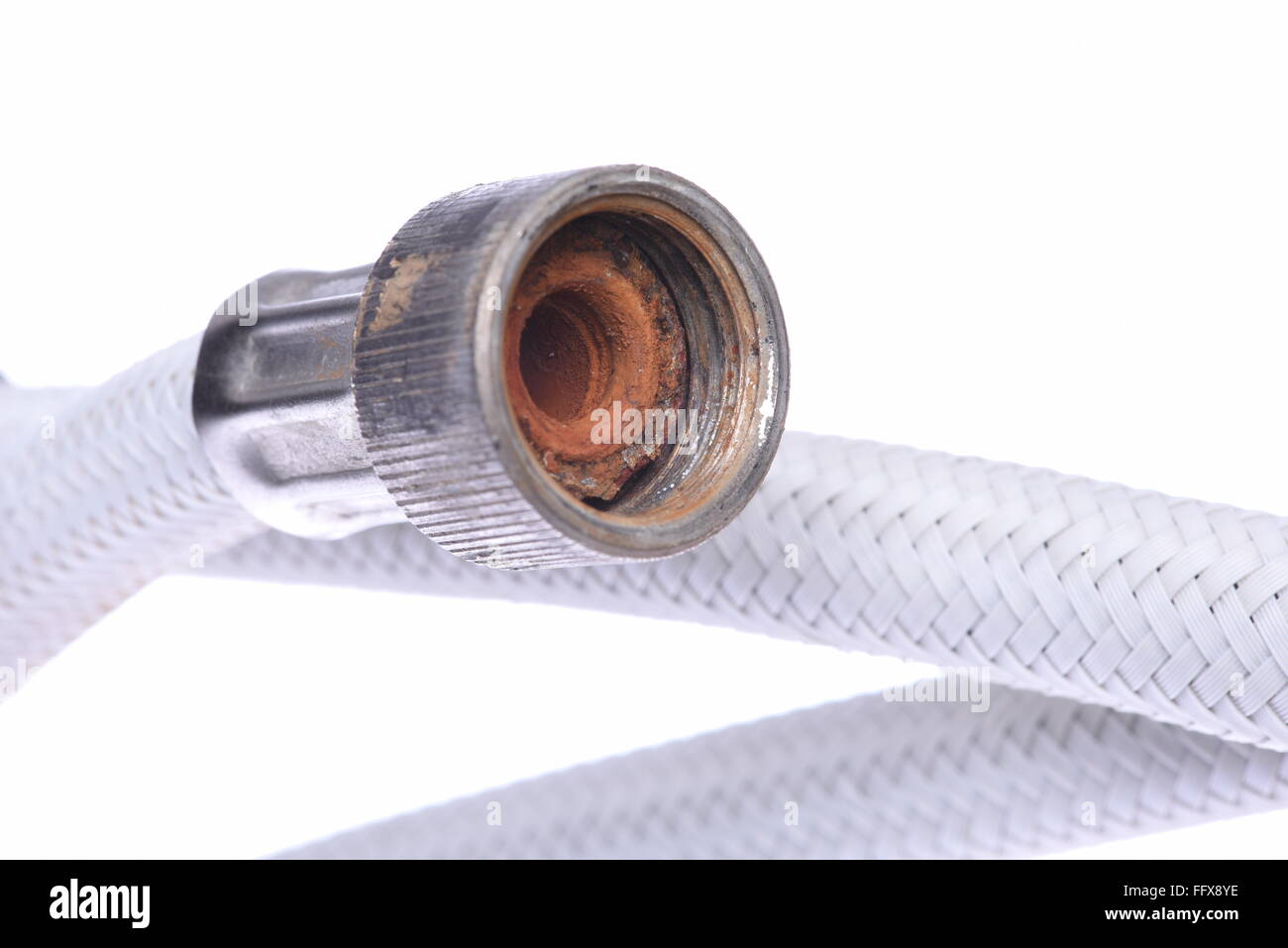 Old flexible metal hose pipe isolated on with white background Stock ...