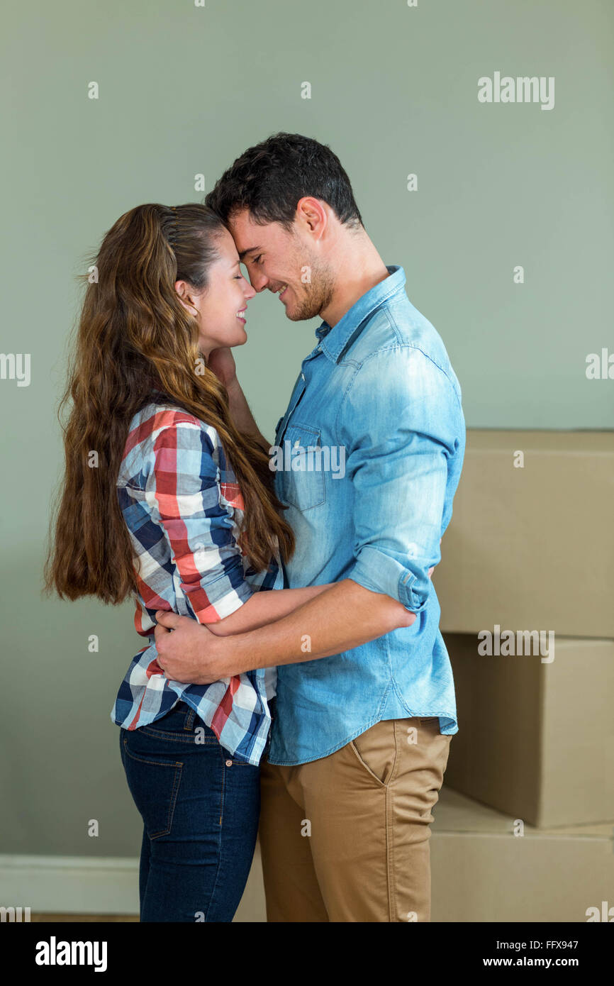 Romantic couple standing face to face and embracing each other Stock ...