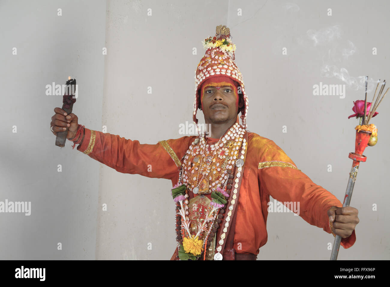 Gondhali from Sholapur District holding incense sticks and holding ...
