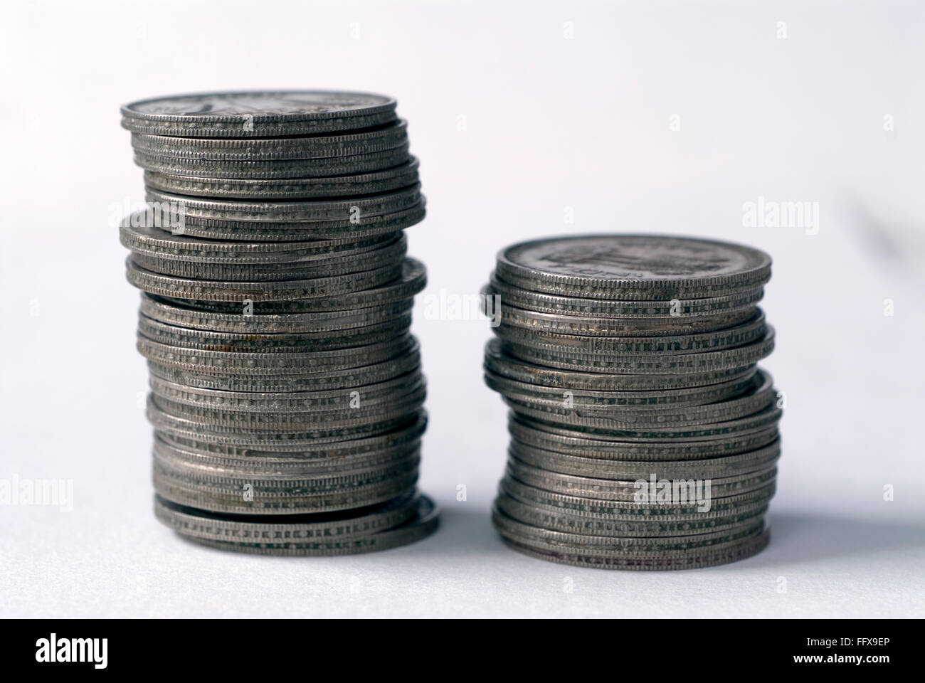 Coins many Indian Rupee round two stacks Stock Photo - Alamy