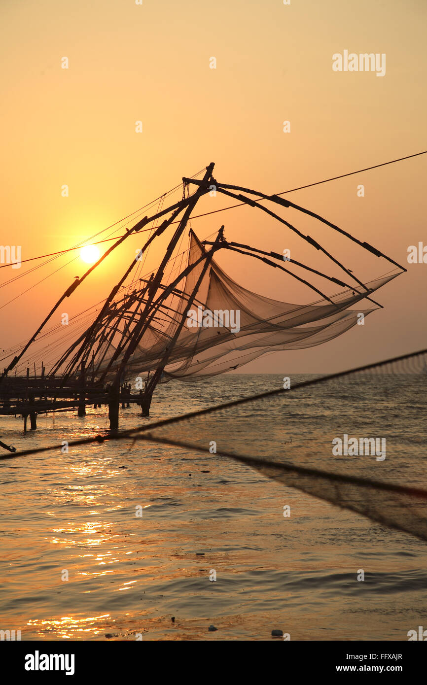 Cantilevered chinese fishing nets sunset hi-res stock photography and ...