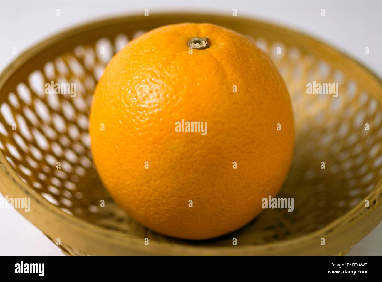 Orange fruit round citrus one single in basket Stock Photo - Alamy
