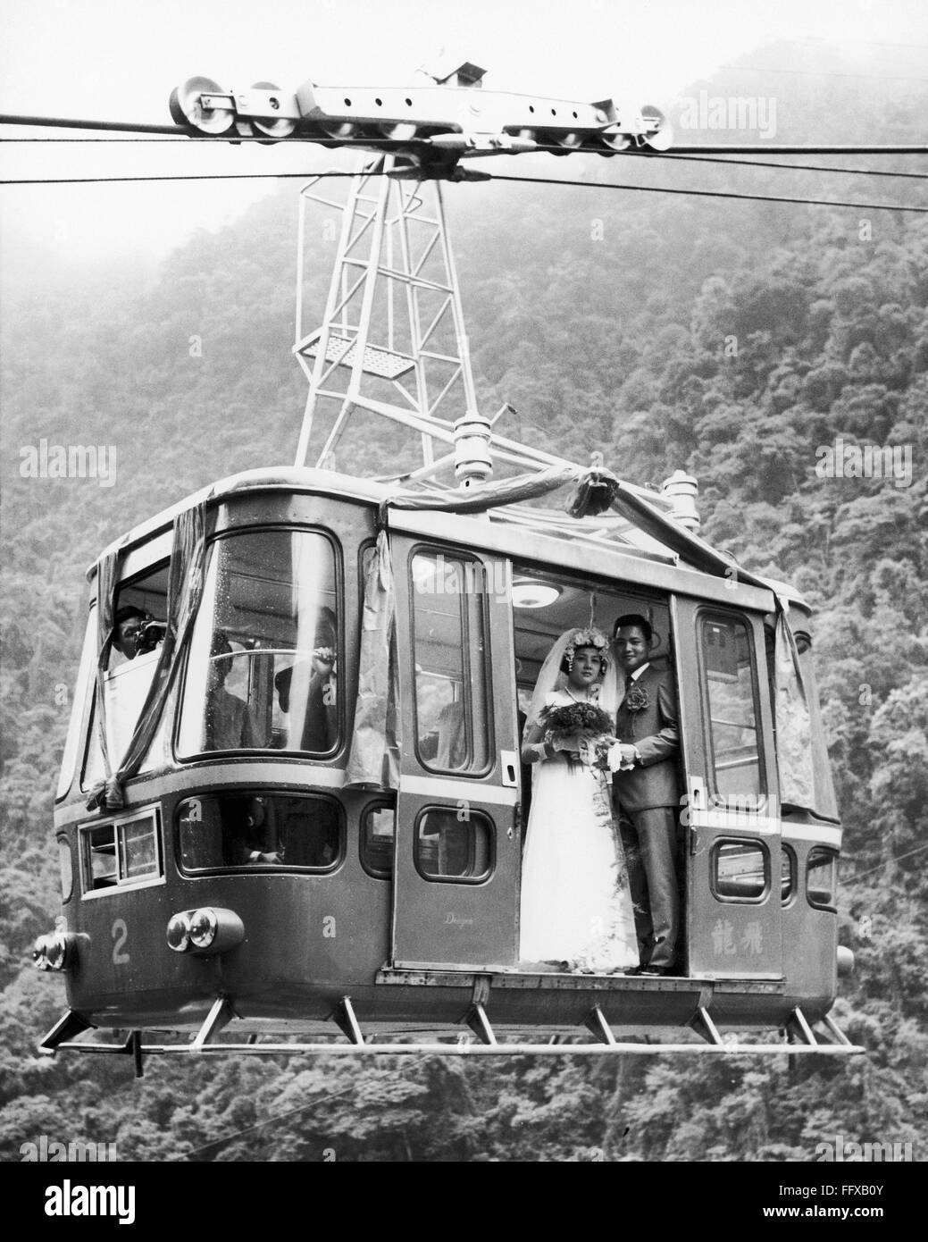 WEDDING: CABLE CAR, 1970. /nA young Taiwanese couple, she a cable car ...