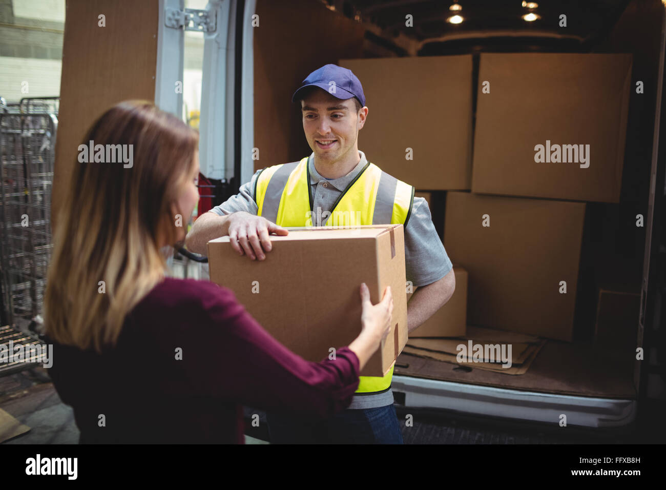 Delivery driver handing hi-res stock photography and images - Alamy