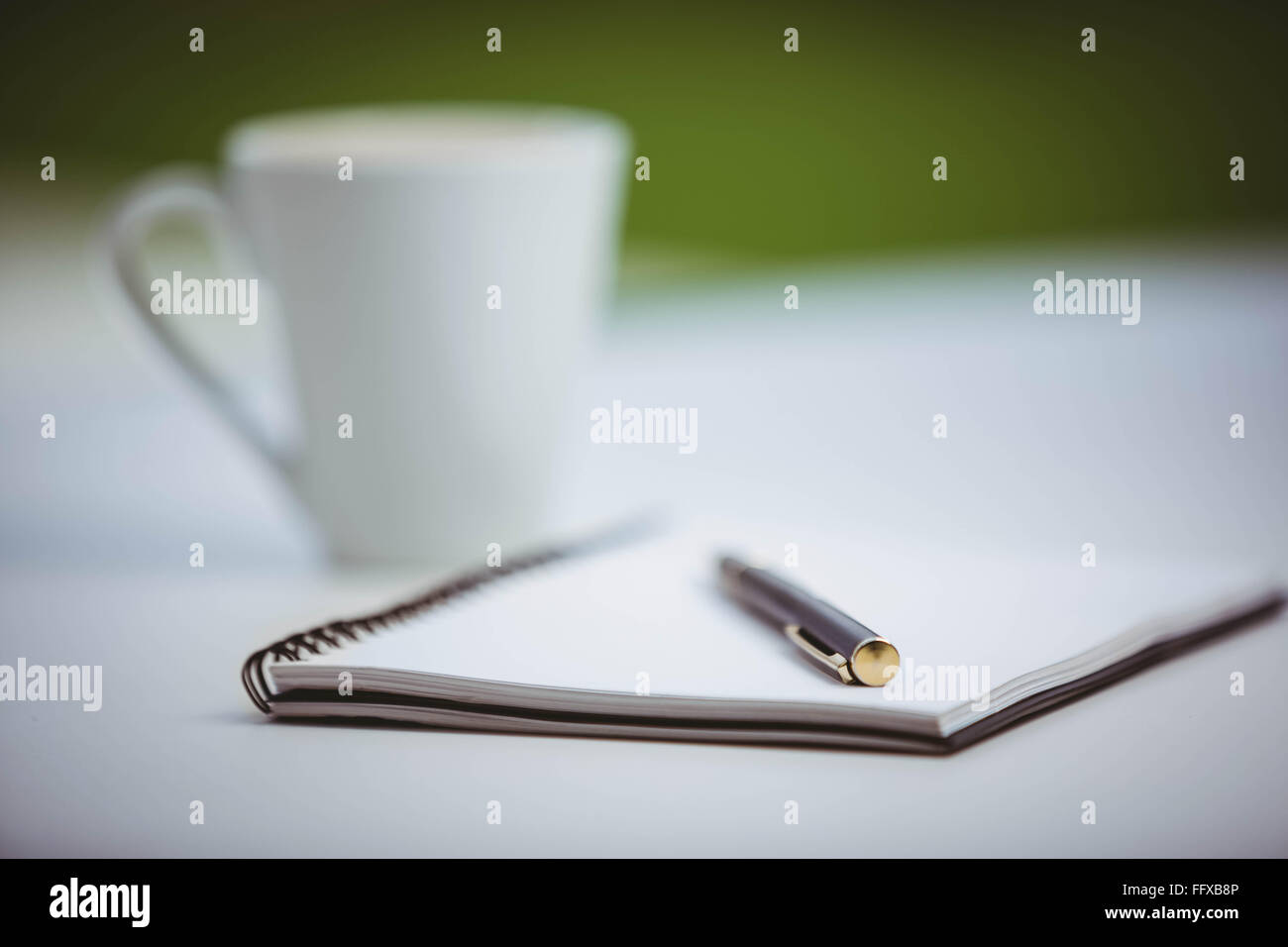 Overhead of notebook with pen and coffee Stock Photo - Alamy