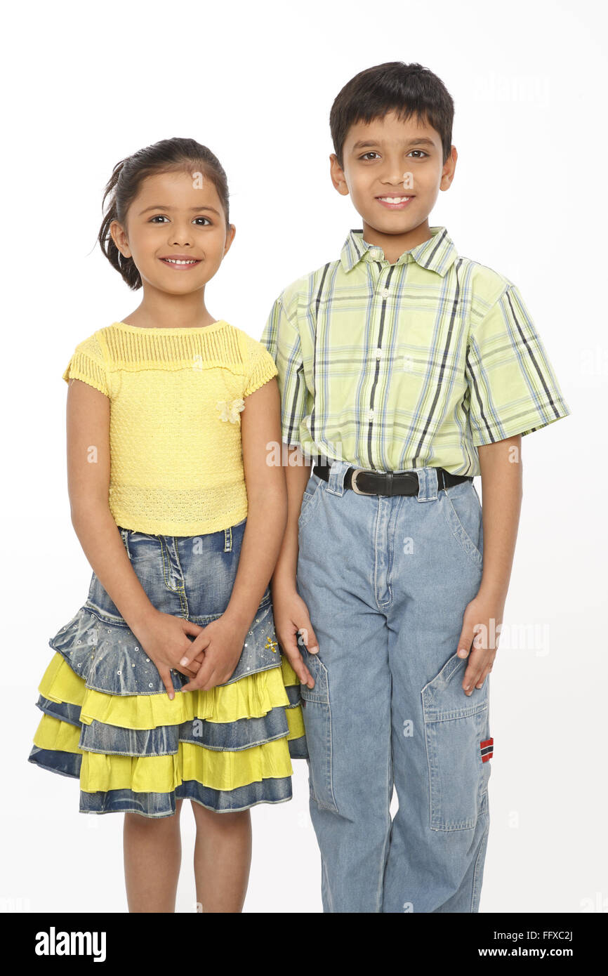 Brother sister standing together wearing hi-res stock photography and ...