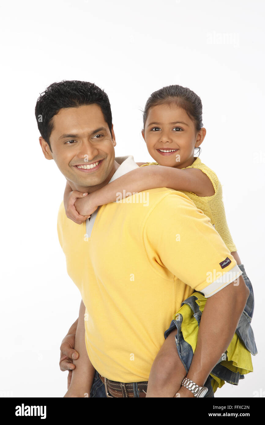 Indian kids on father back hi-res stock photography and images - Alamy