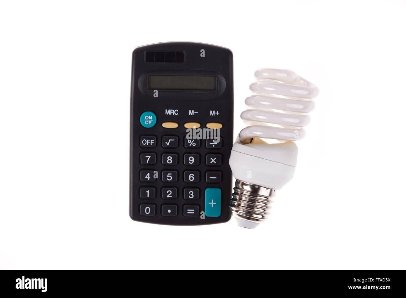 Energy-saving lamp and calculator on white background Stock Photo - Alamy