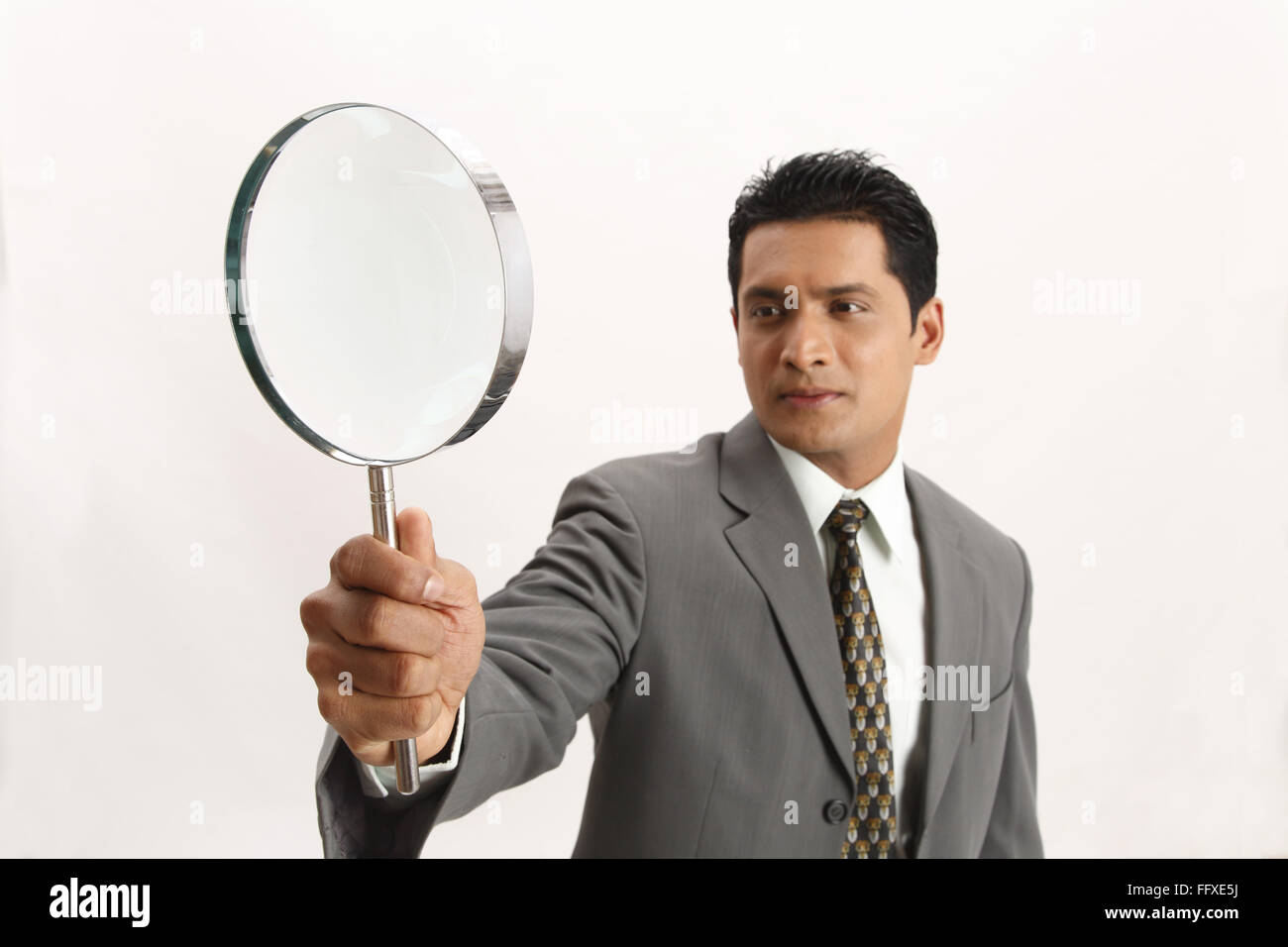 Magnifying businessman hi-res stock photography and images - Alamy