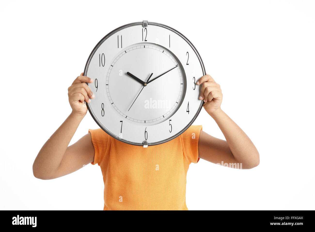 Boy holding wall clock in front of his face with both hand MR#703V ...