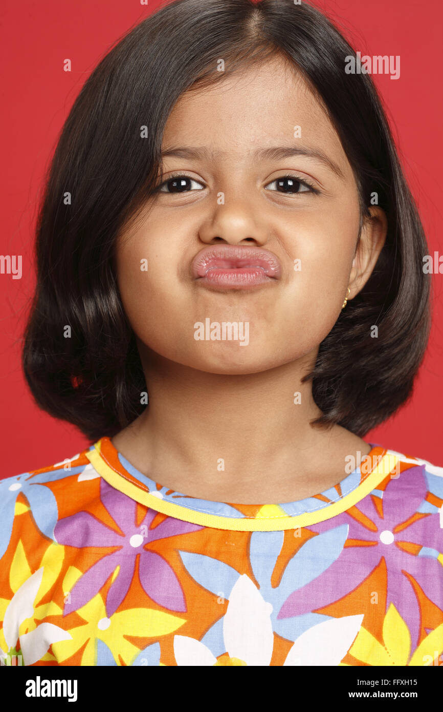 Eight year old girl making funny lips and face expression MR#703U Stock ...