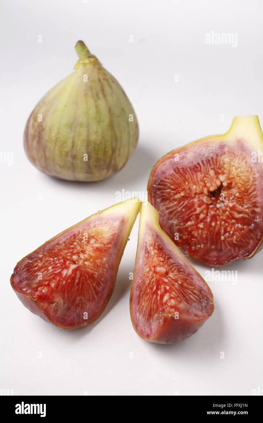 Fruit, one full Fig Ficus Carica Anjir and another cut in three pieces ...
