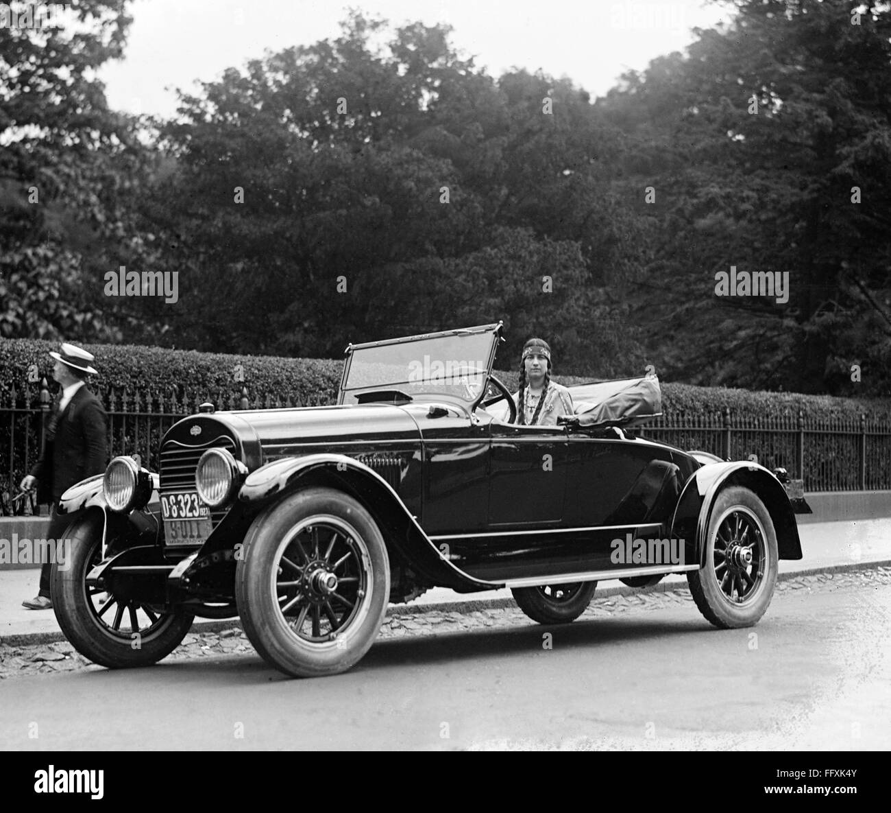AUTOMOBILE, 1923. /nA woman wearing Native American clothing, in a car ...