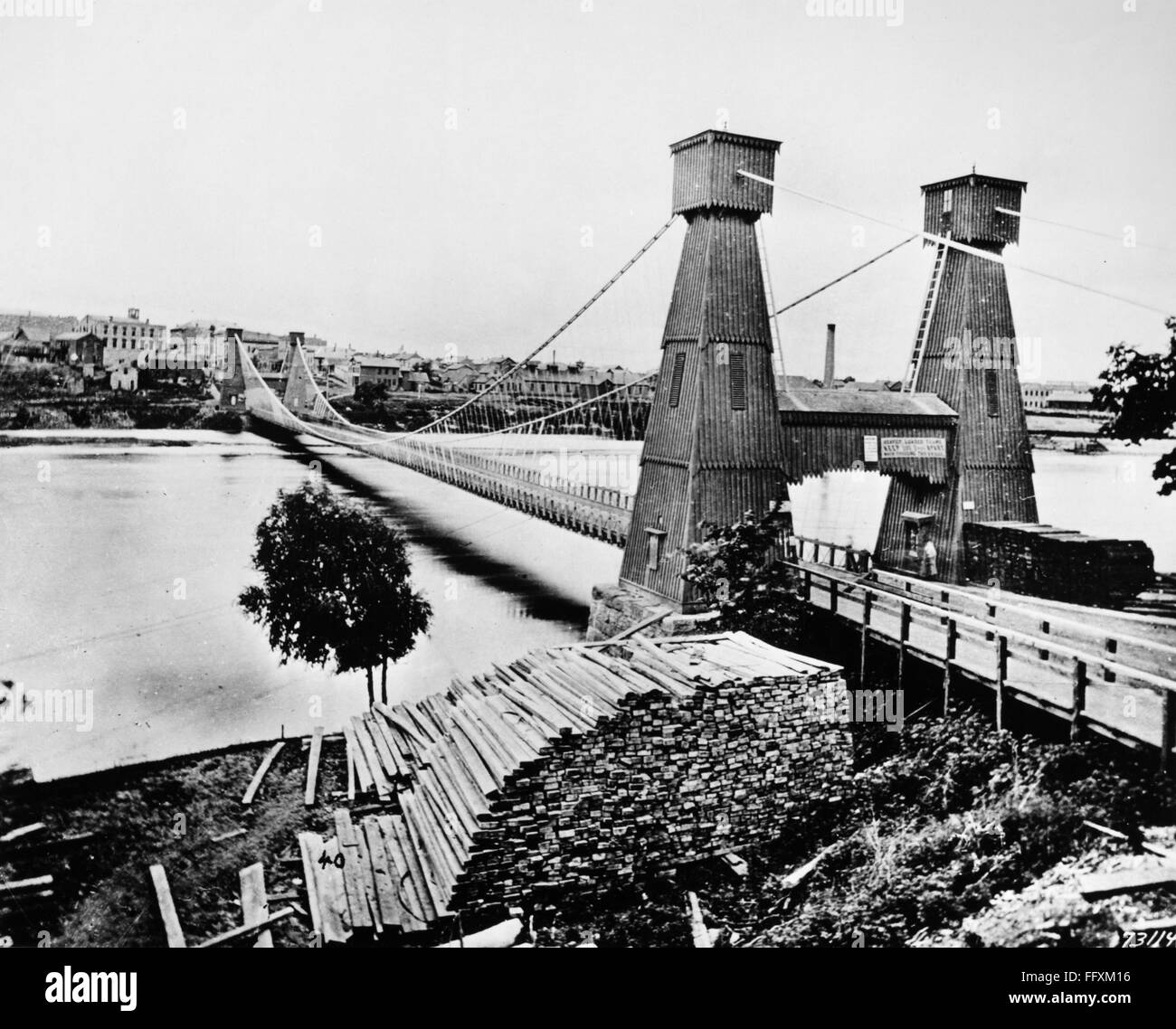MINNEAPOLIS: BRIDGE, c1857. /nA view of the first suspension bridge in ...