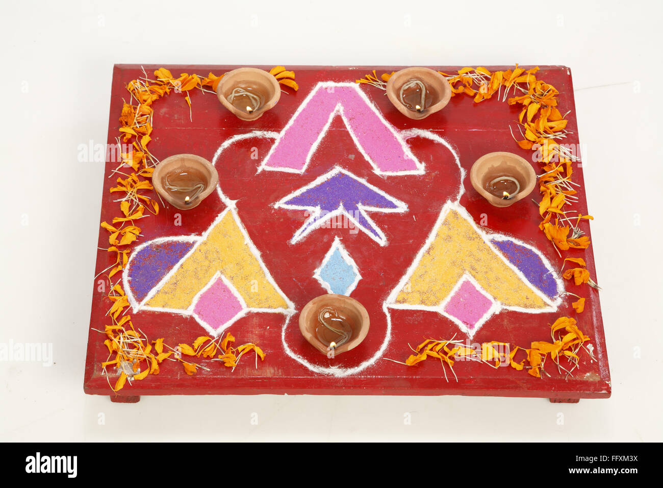 Auspicious design and border with petals of flowers on wooden seat for ...