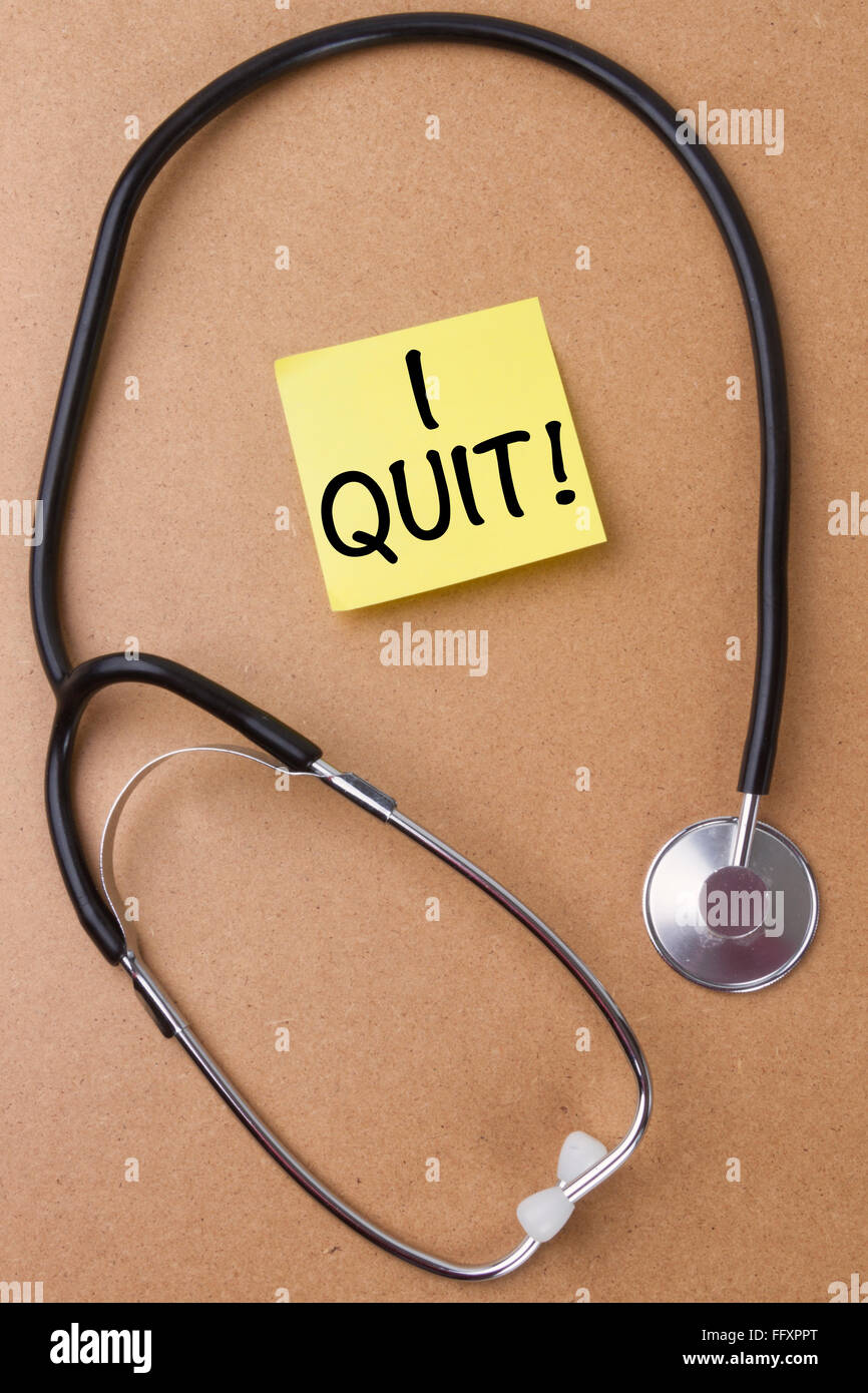 Stethoscope and a yellow sticky note with the words "I Quit!" on a ...