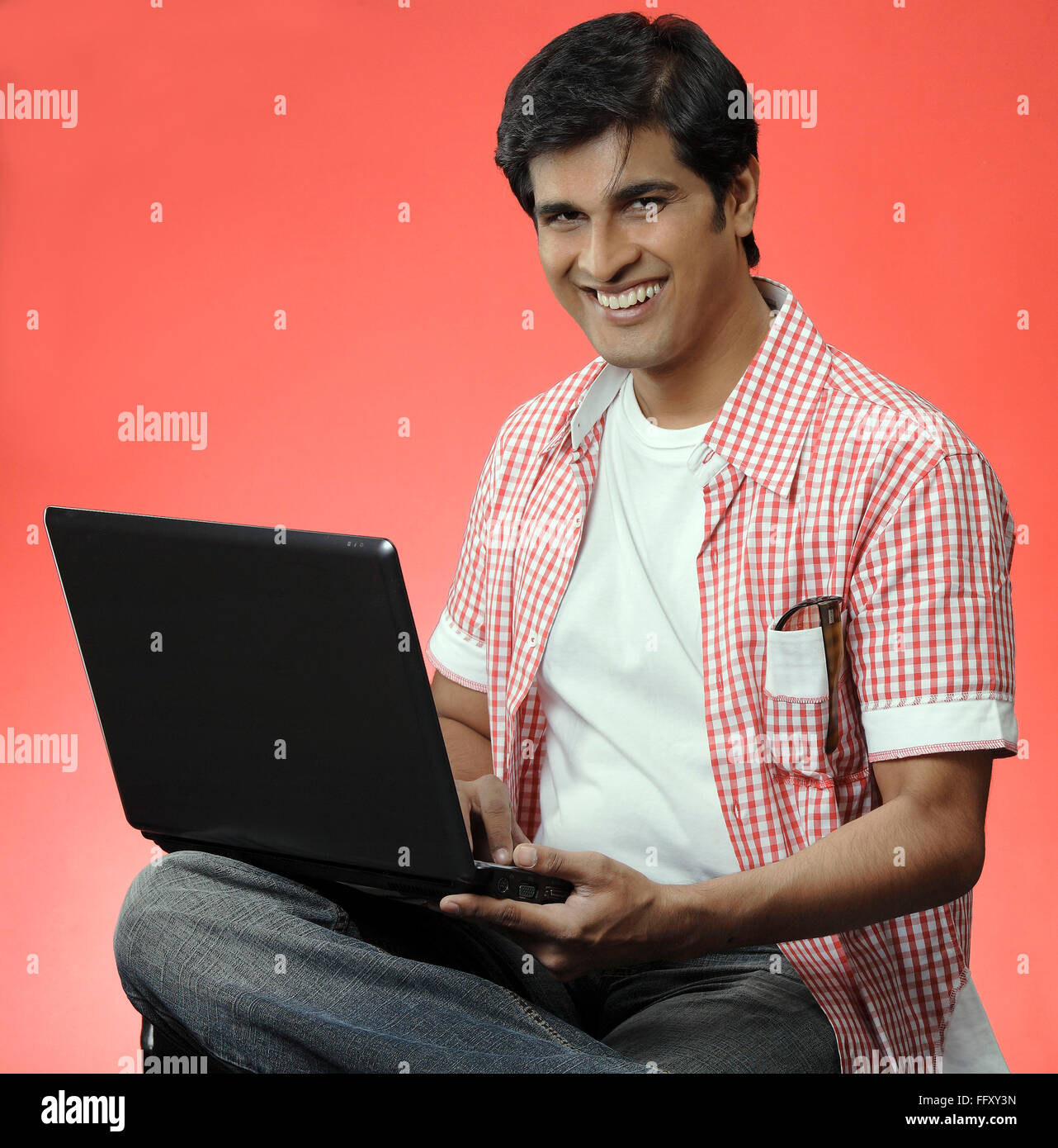 South Asian Indian man using laptop , India MR#732A Stock Photo - Alamy