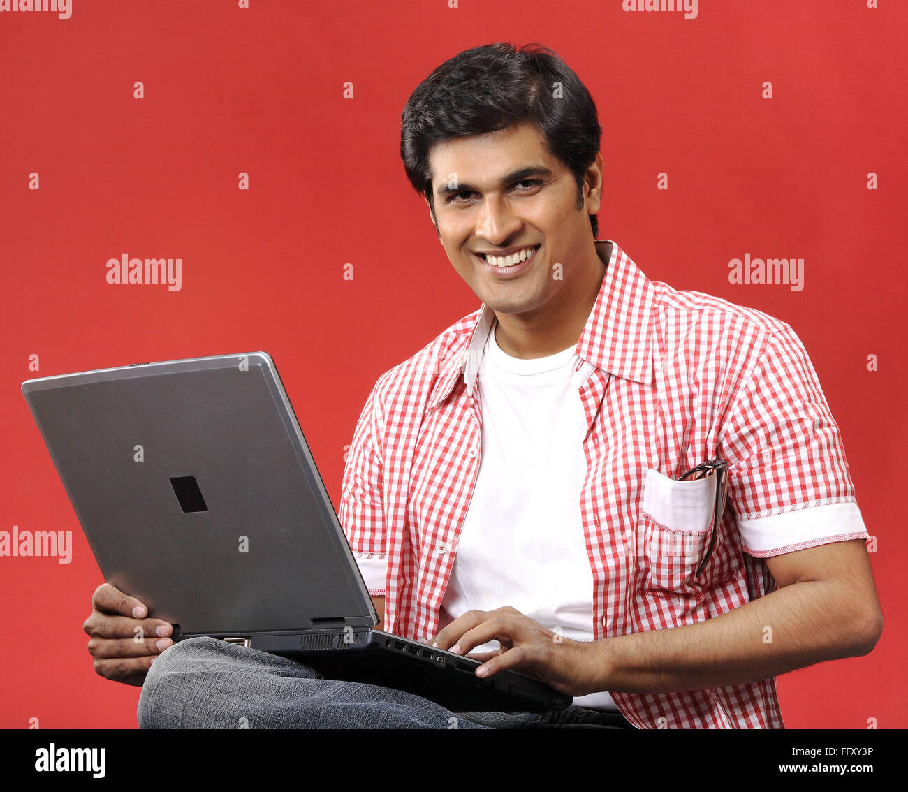 South Asian Indian man using laptop , India MR#732A Stock Photo - Alamy