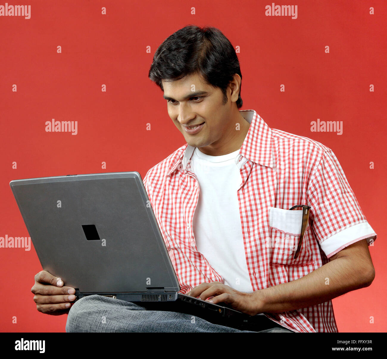 South Asian Indian man using laptop , India MR#732A Stock Photo - Alamy