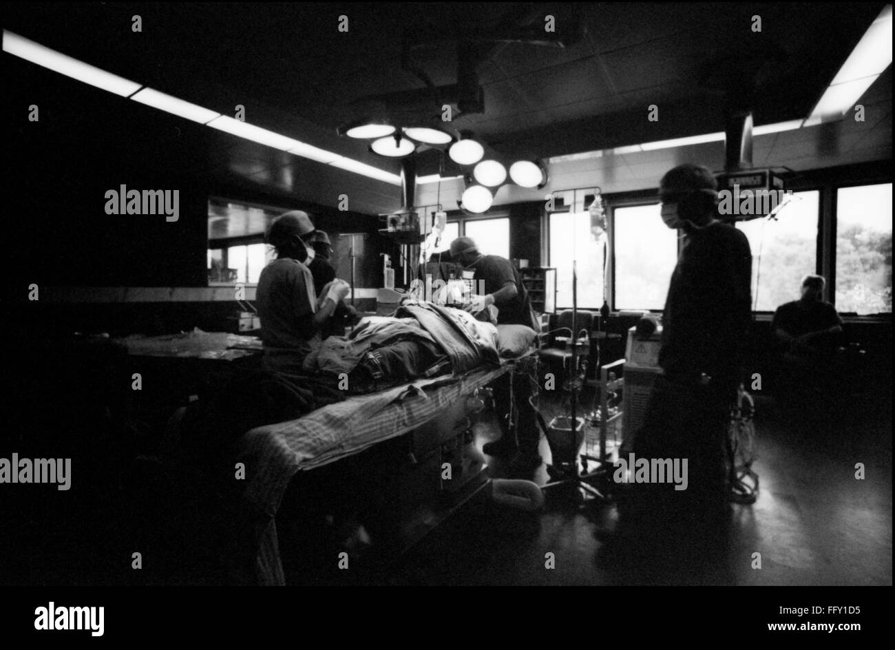 Operating Room With Surgeons Performing Surgery Stock Photo - Alamy Operating Room With Surgeons Performing Surgery Stock Photo - Alamy