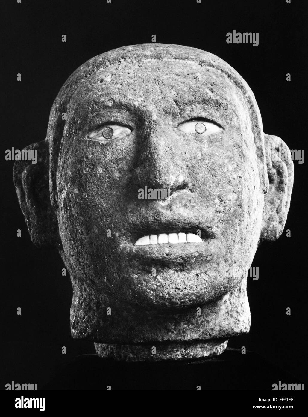 AZTEC: HEAD, 15TH CENTURY./nBasalt sculpture of a male head, with ...