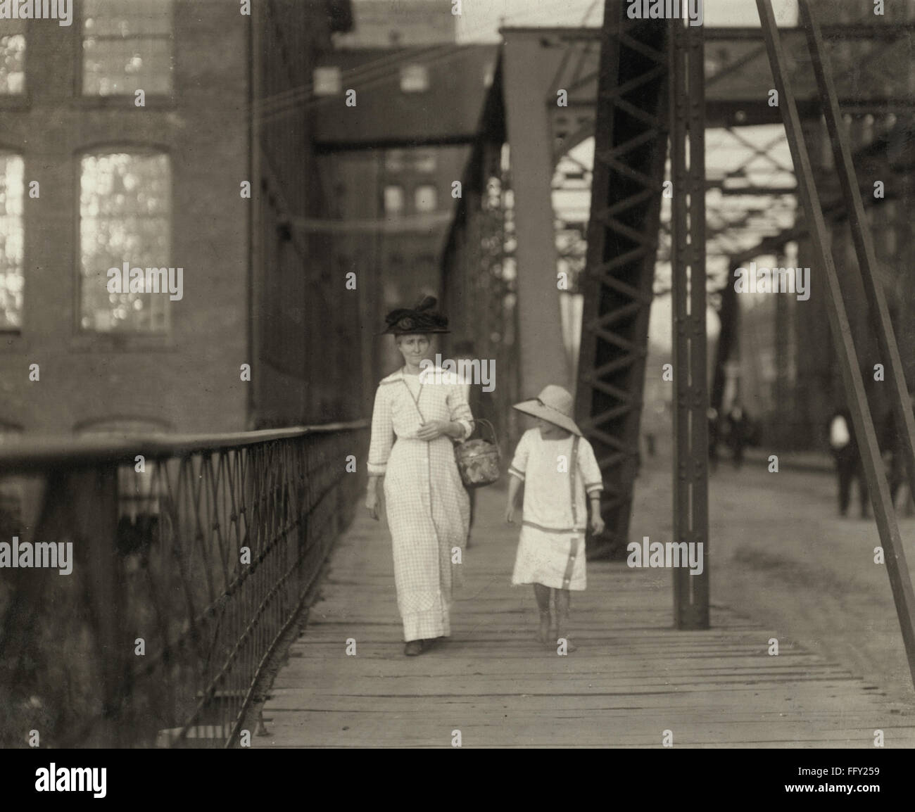 HINE: CHILD LABOR, 1913. /nA woman and a girl walking home from working ...