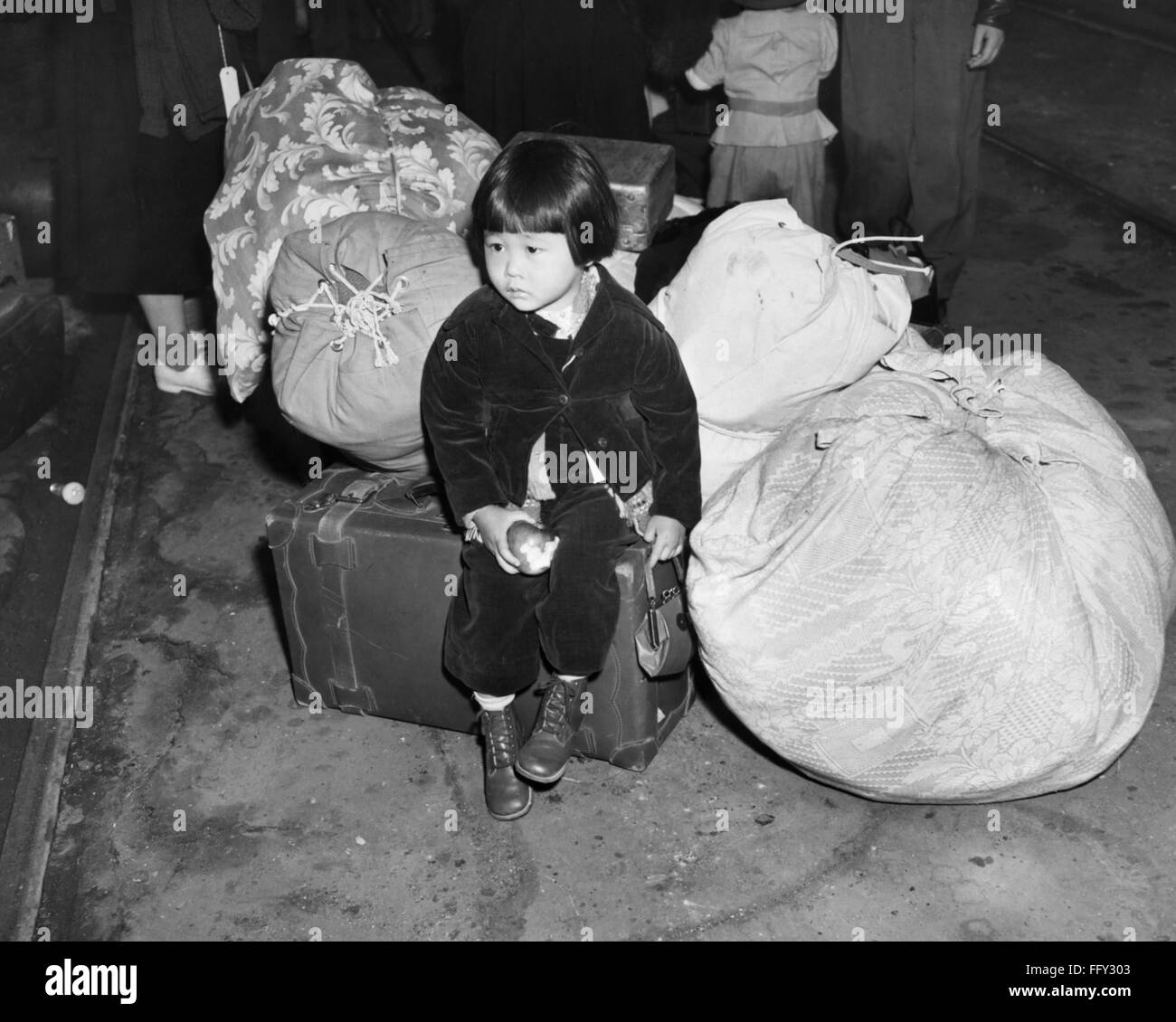 JAPANESE INTERNMENT, 1942. /nA Japanese American child at a train ...