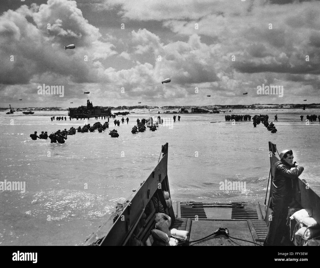 WORLD WAR II: NORMANDY. /nReinforcements and supplies arrive at the ...