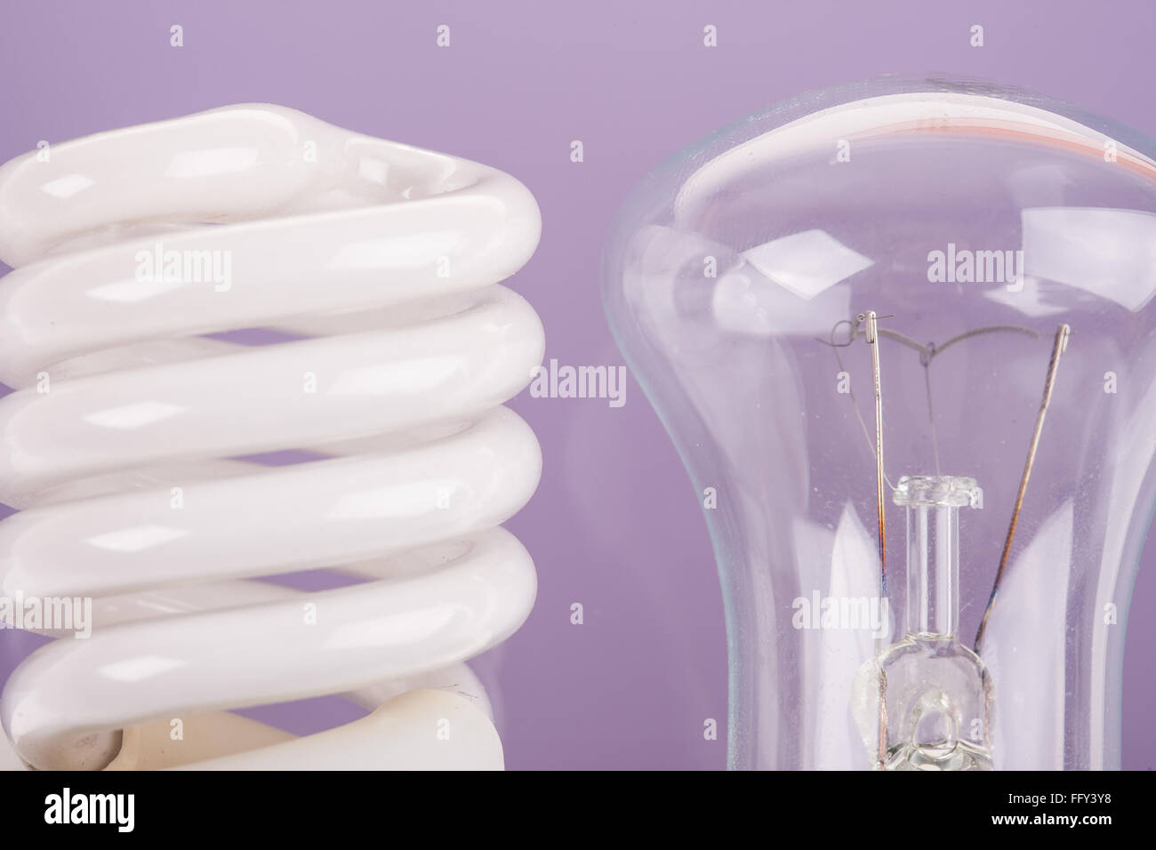 two types of light bulbs on blue background Stock Photo - Alamy