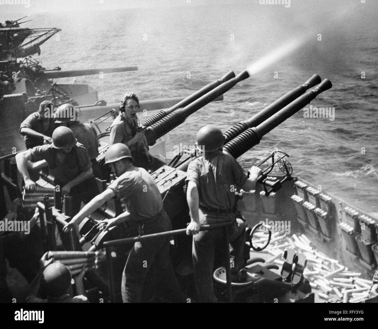 WWII: ANTI-AIRCRAFT GUNS. /nCrew members on board a U.S. Navy aircraft ...