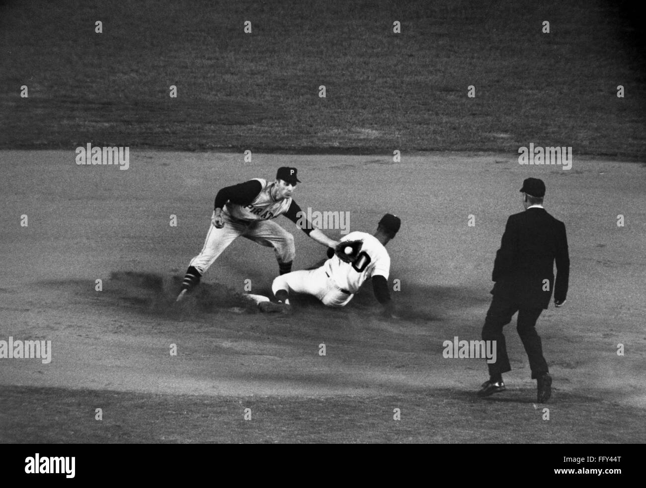 MAURY WILLS (1932- ). /nAmerican baseball player. Sliding safely into ...