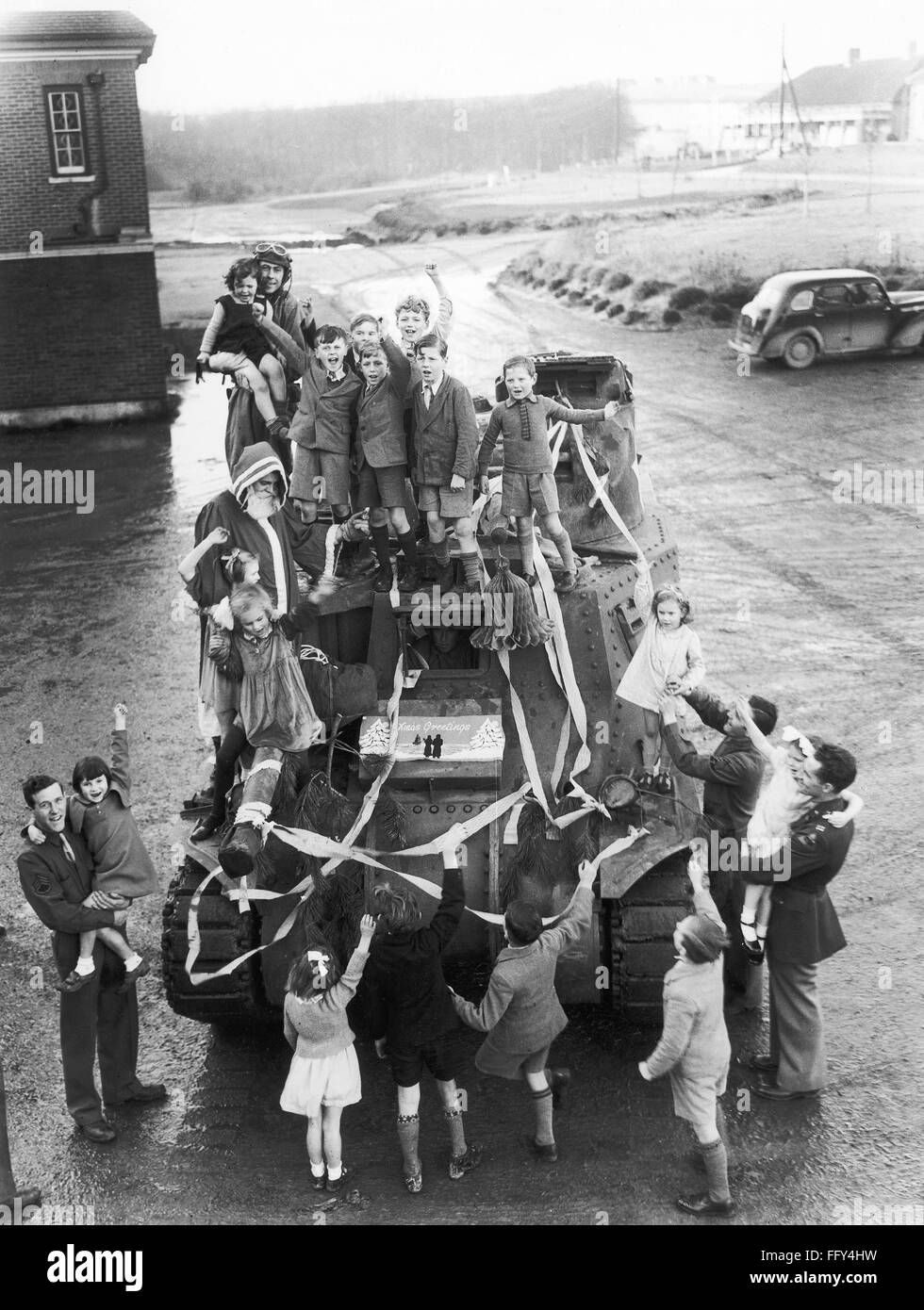 WWII ORPHANS: CHRISTMAS. /nA U.S. Army armored unit station gives a ...