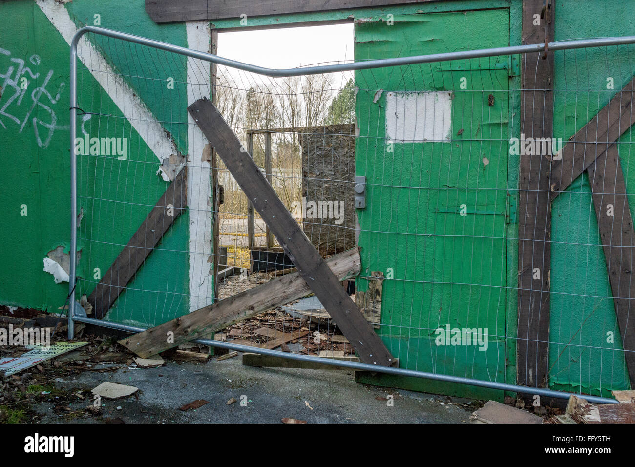 Boarded up entrance to a vandalised theme park Stock Photo - Alamy