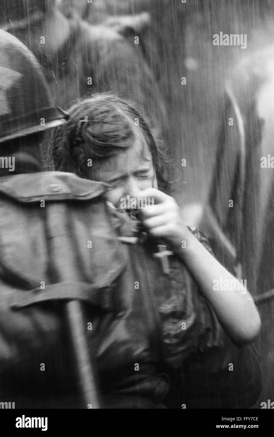 FILM: SAVING PRIVATE RYAN. /nA scared young girl in the arms of an ...